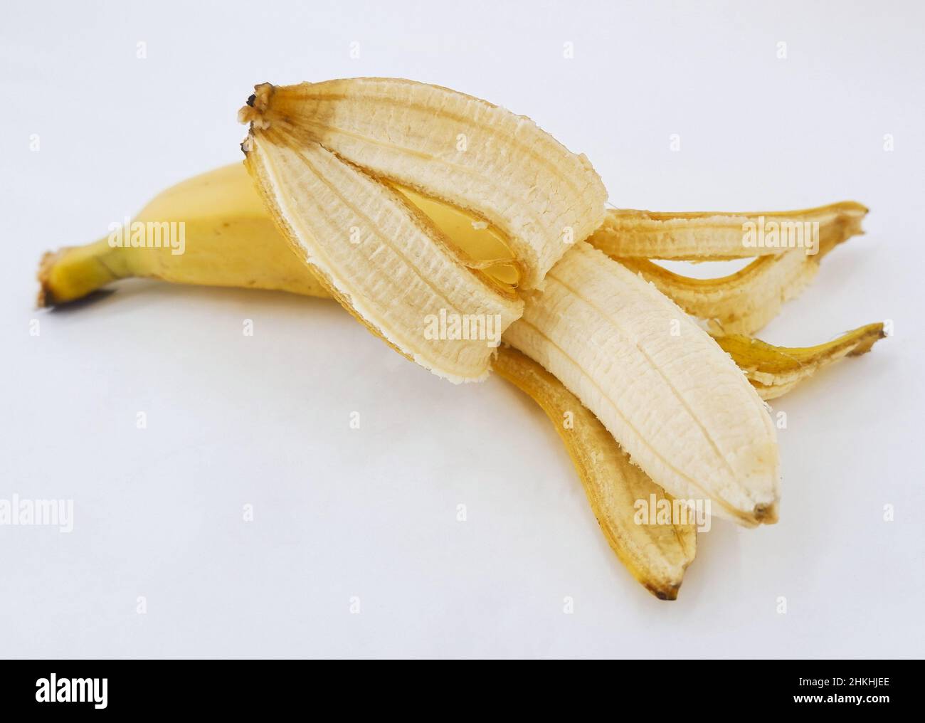 Half peeled banana in hi-res stock photography and images - Alamy