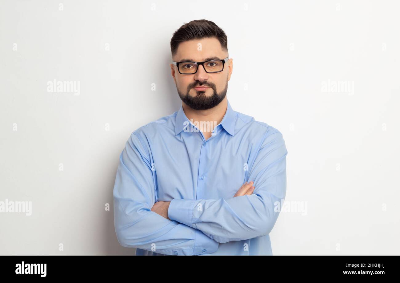 Portrait of a business man with a beard in glasses and a shirt on a ...