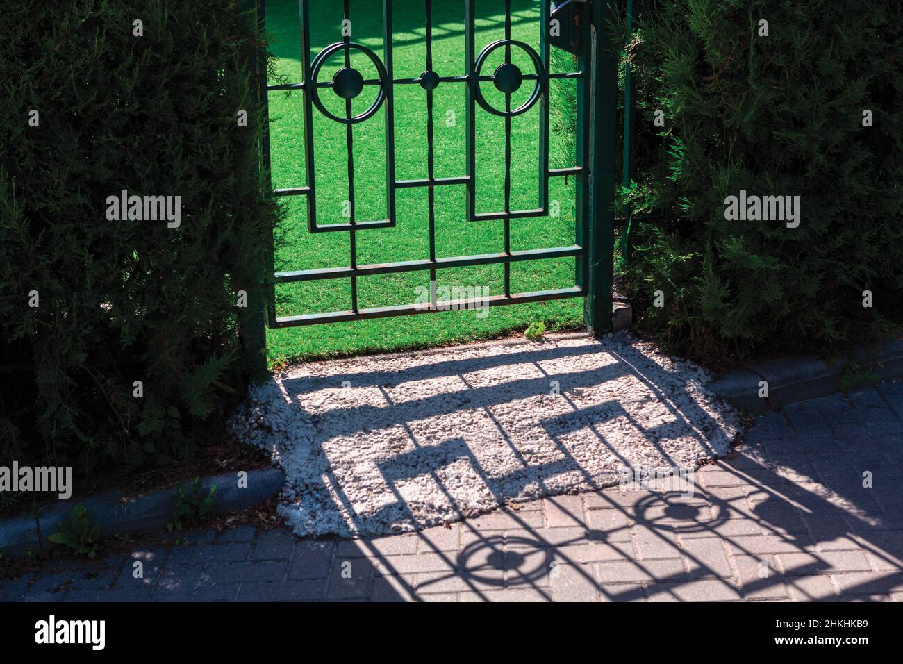 Wrought Iron Metal Garden Gate . Looking through the gate Stock Photo ...