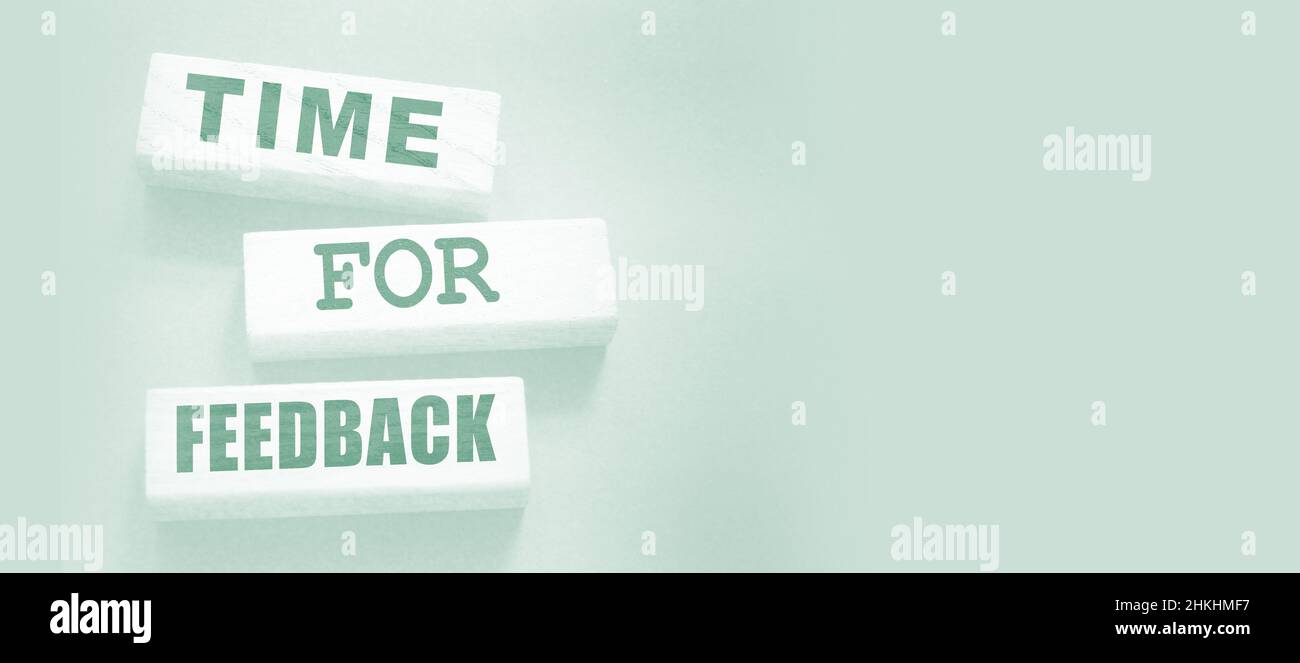 Time fir feedback text on wooden blocks. Product or service evaluation ...