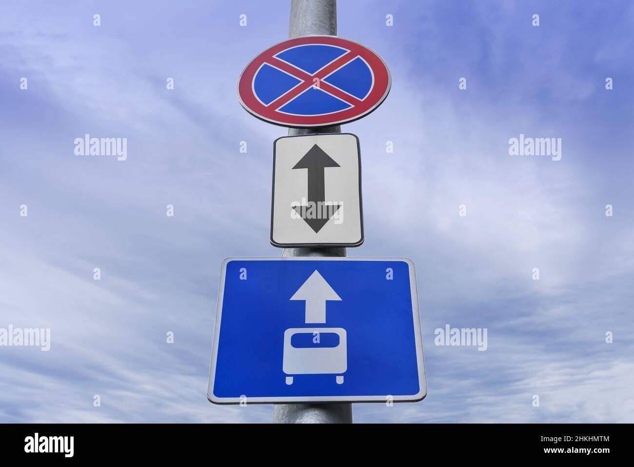 Several traffic signs on street lamppost Stock Photo - Alamy