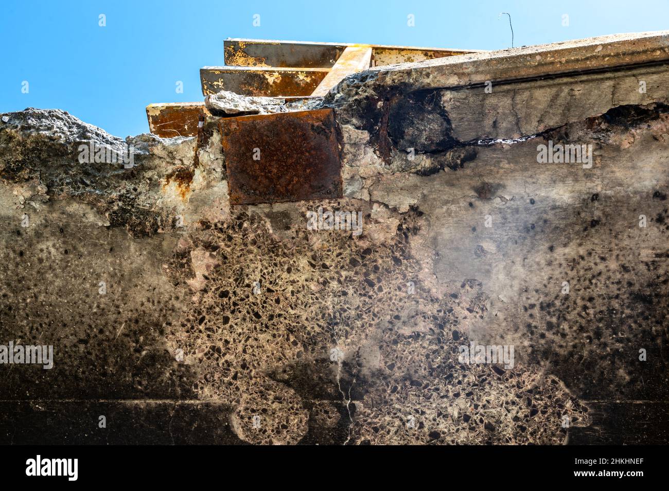 Crumbling concrete under a bridge support rail in need of repair Stock ...
