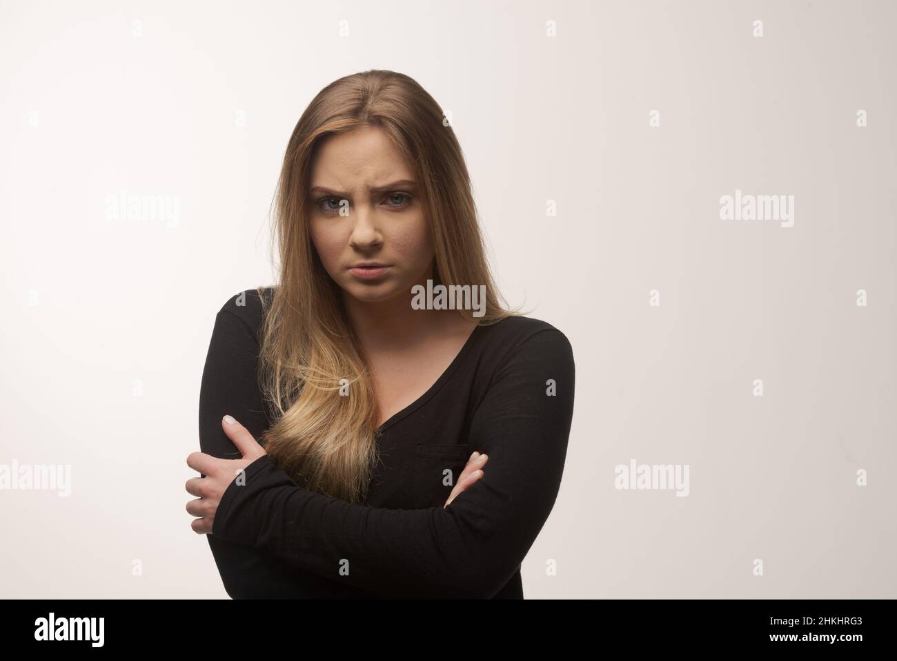 Angry sad young woman portrait in studio white background Stock Photo ...