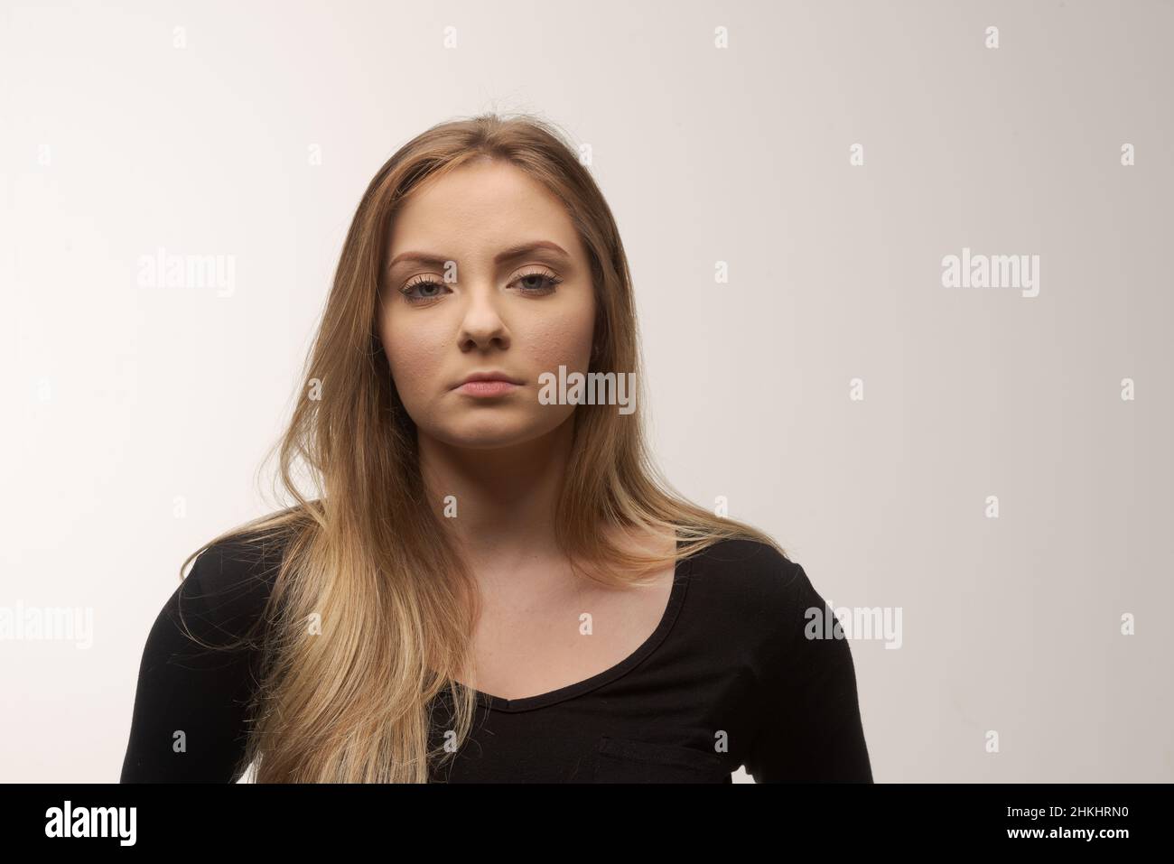 Angry sad young woman portrait in studio white background Stock Photo ...