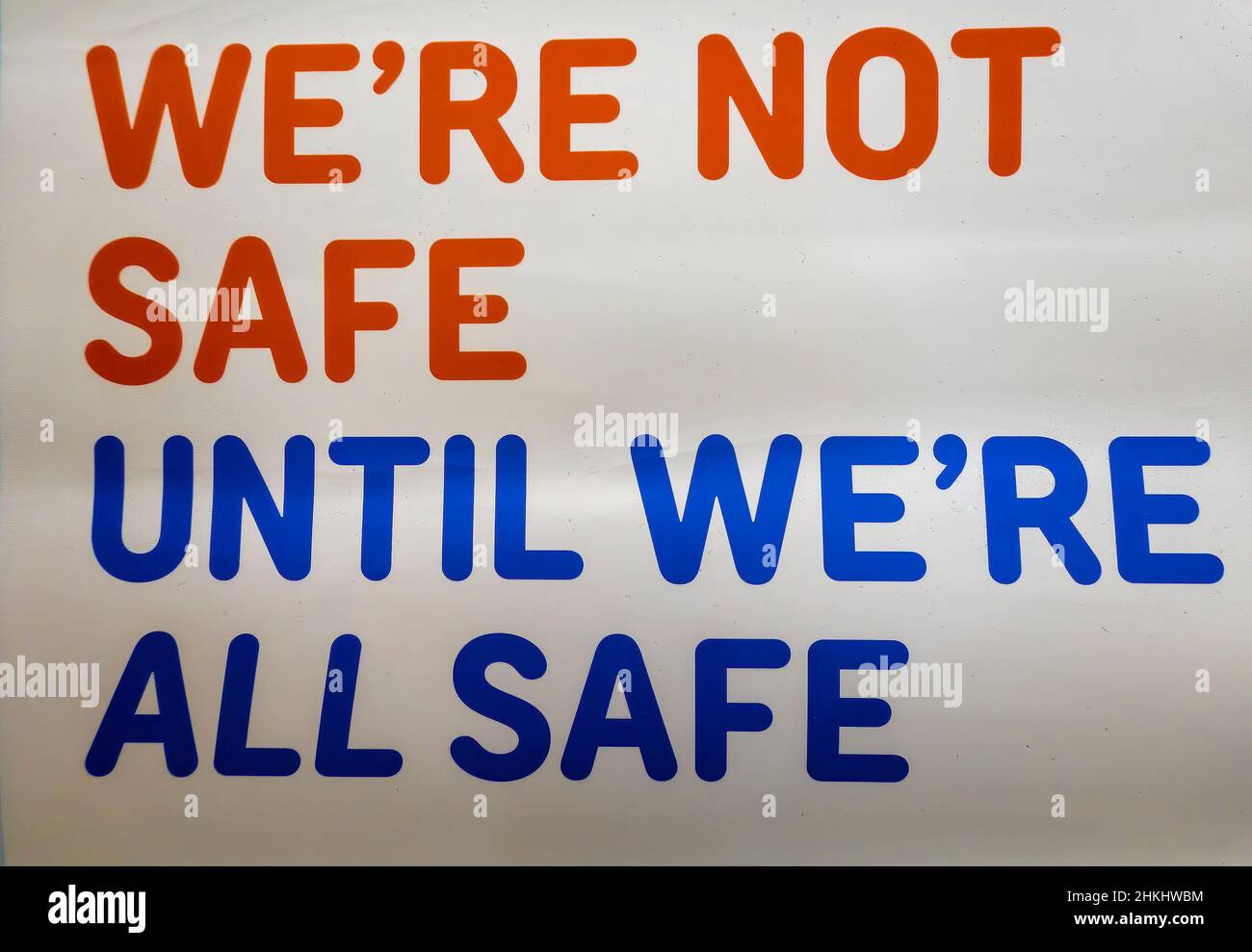 We're not safe until we're all safe sign referring to the pandemic ...