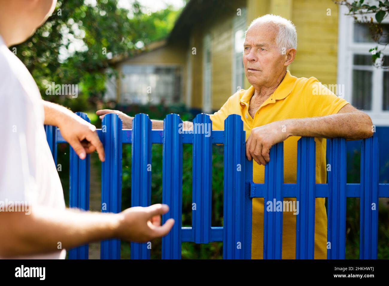 Two men chatting home hi-res stock photography and images - Alamy