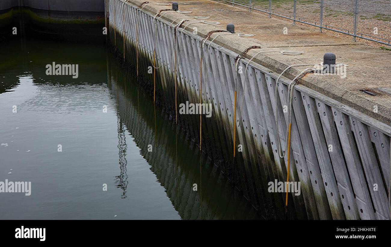 Side of the marine lock with moorings and ropes Stock Photo - Alamy