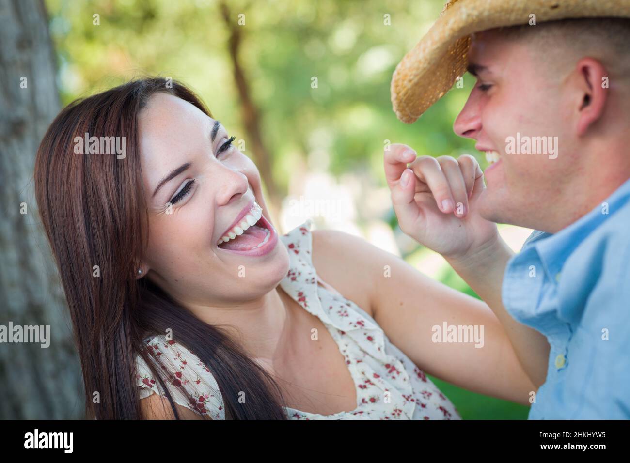 Happy Romantic Caucasian Couple Talking in the Park Stock Photo - Alamy