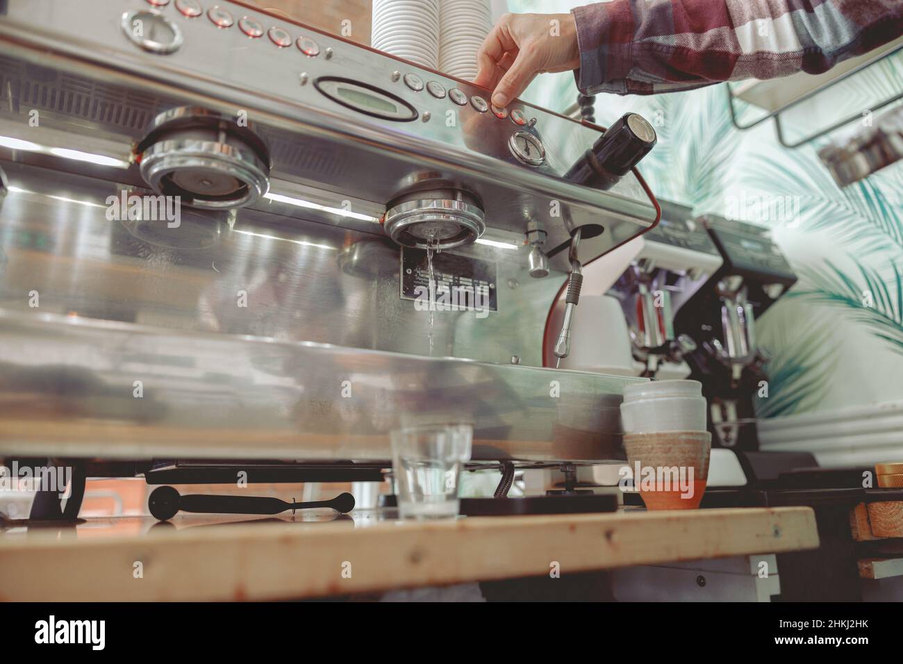 Process of flushing group head of coffee machine in cafe Stock Photo ...