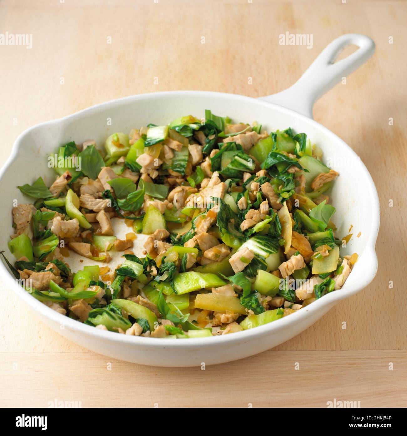 Turkey and vegetables stir-fly in white ceramic dish Stock Photo - Alamy