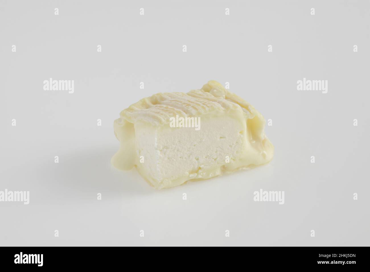 Slice of French Lingot de la Ginestarie ewe's milk cheese Stock Photo ...