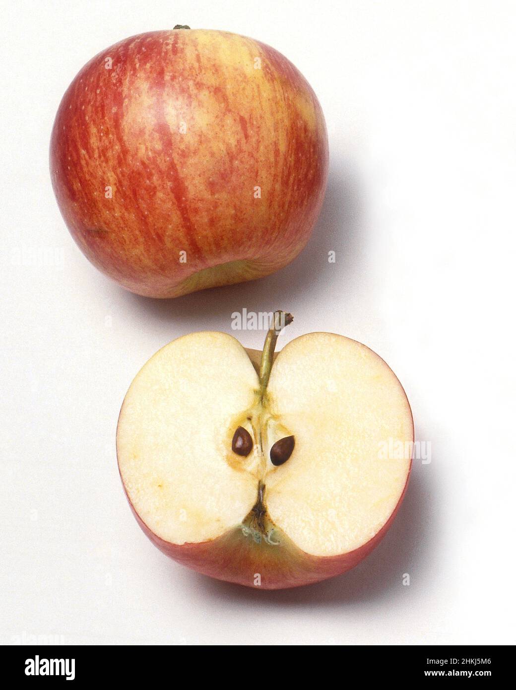 Half of an apple showing flesh, core, pips and stalk Stock Photo - Alamy