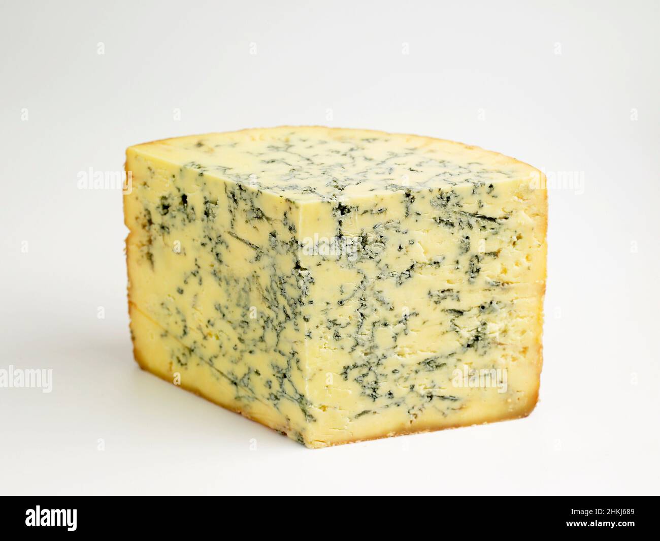 Slice of English Cropwell Bishop blue stilton cheese Stock Photo - Alamy