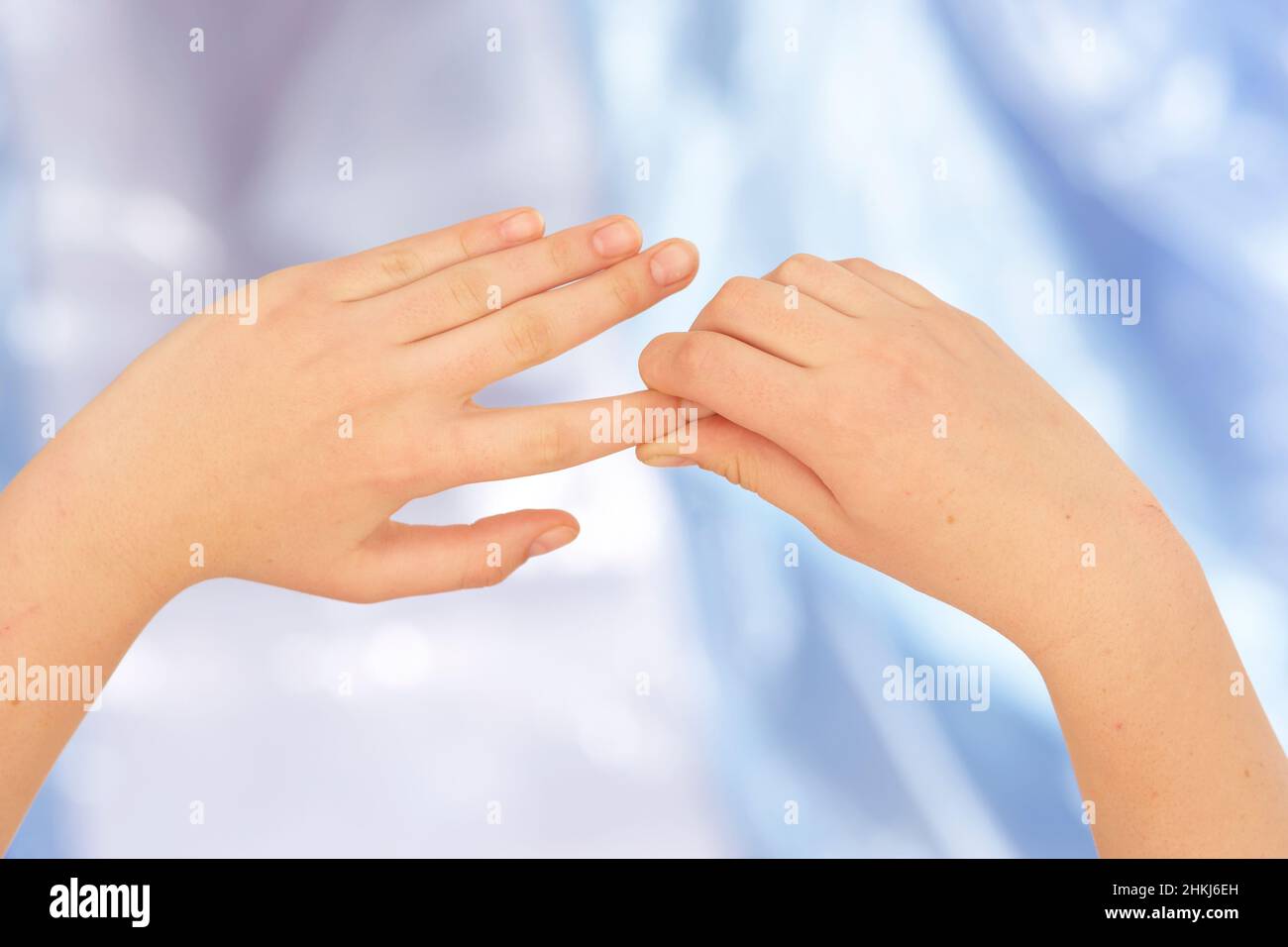 Woman massaging index finger using thumb-walking technique Stock Photo ...