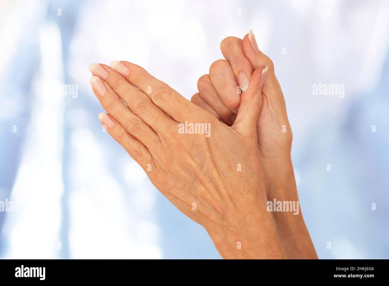 Woman massaging her own thumb using thumb-walking technique Stock Photo ...