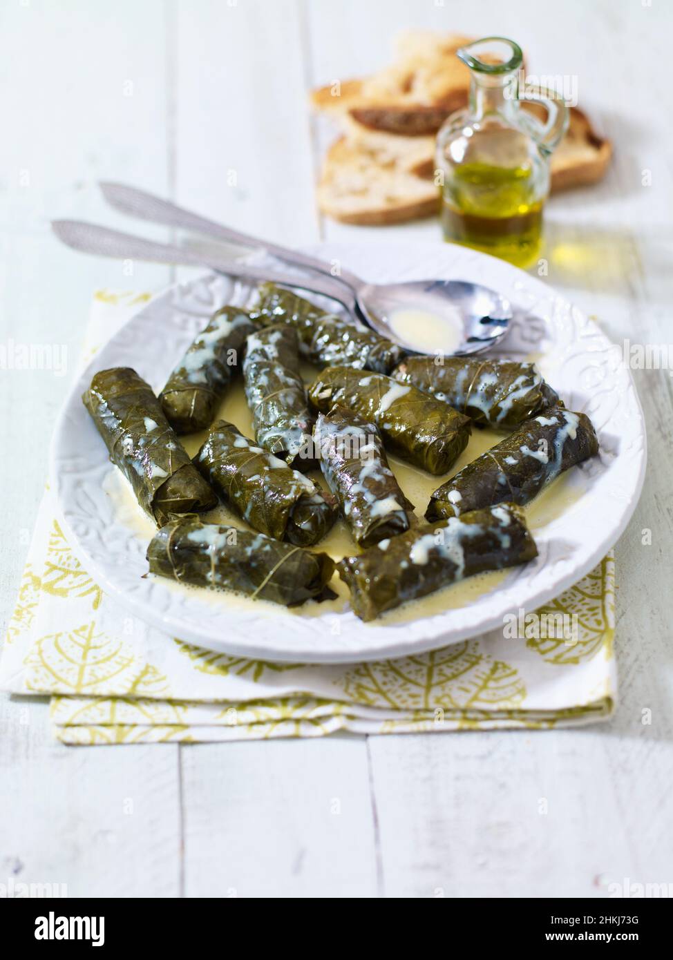 Greek stuffed vine leaves in creamy sauce Stock Photo - Alamy