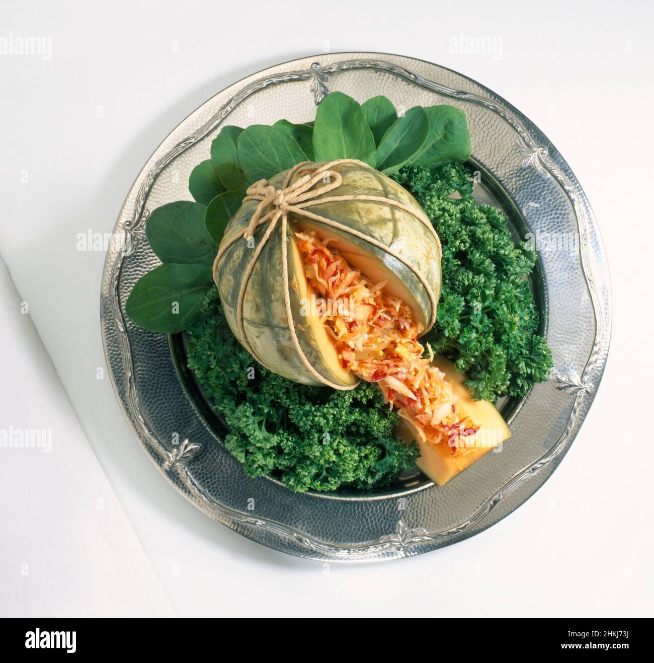 Melon filled with pickled fruit and spices Stock Photo - Alamy