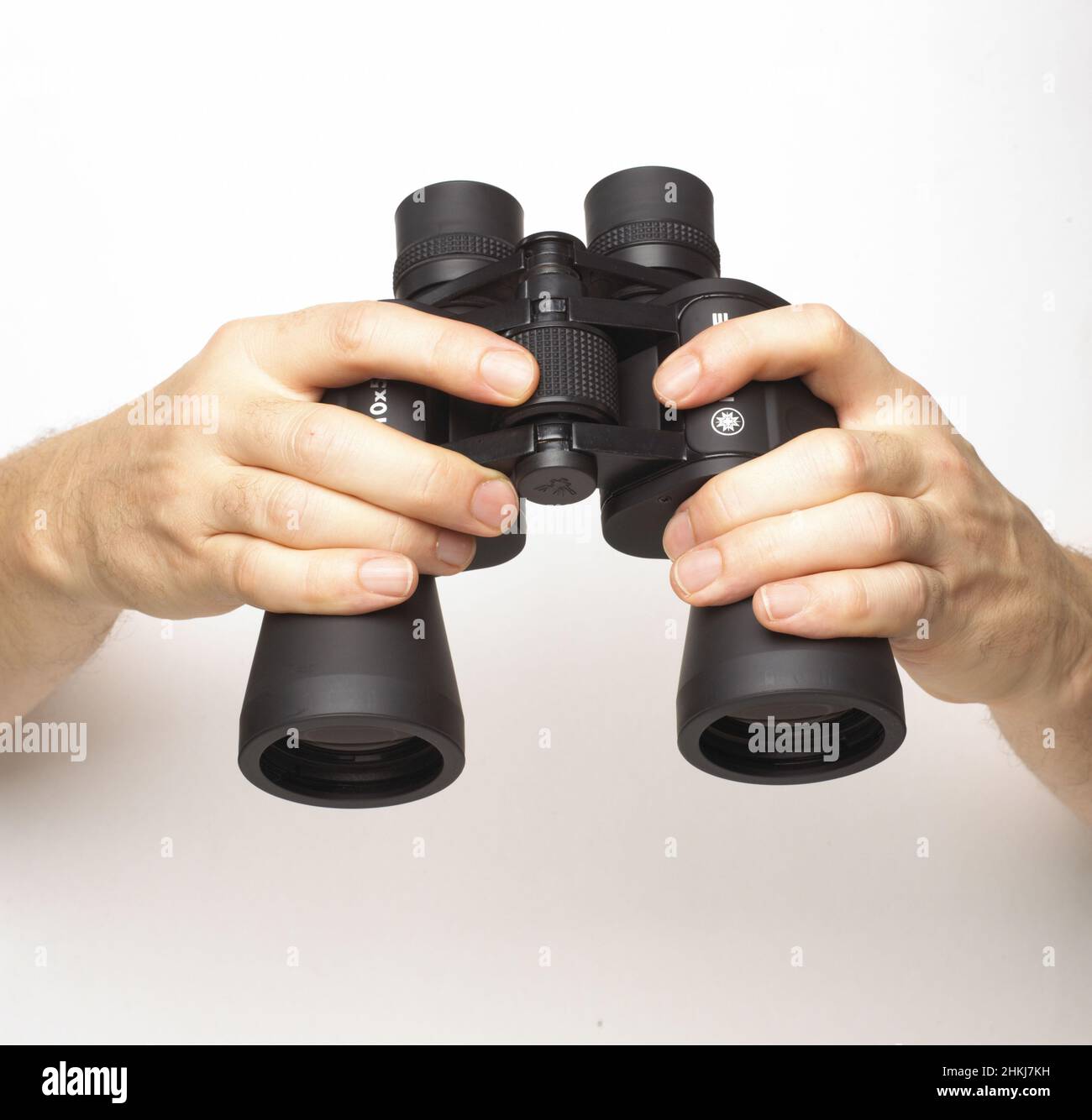 Hands holding binoculars Stock Photo - Alamy