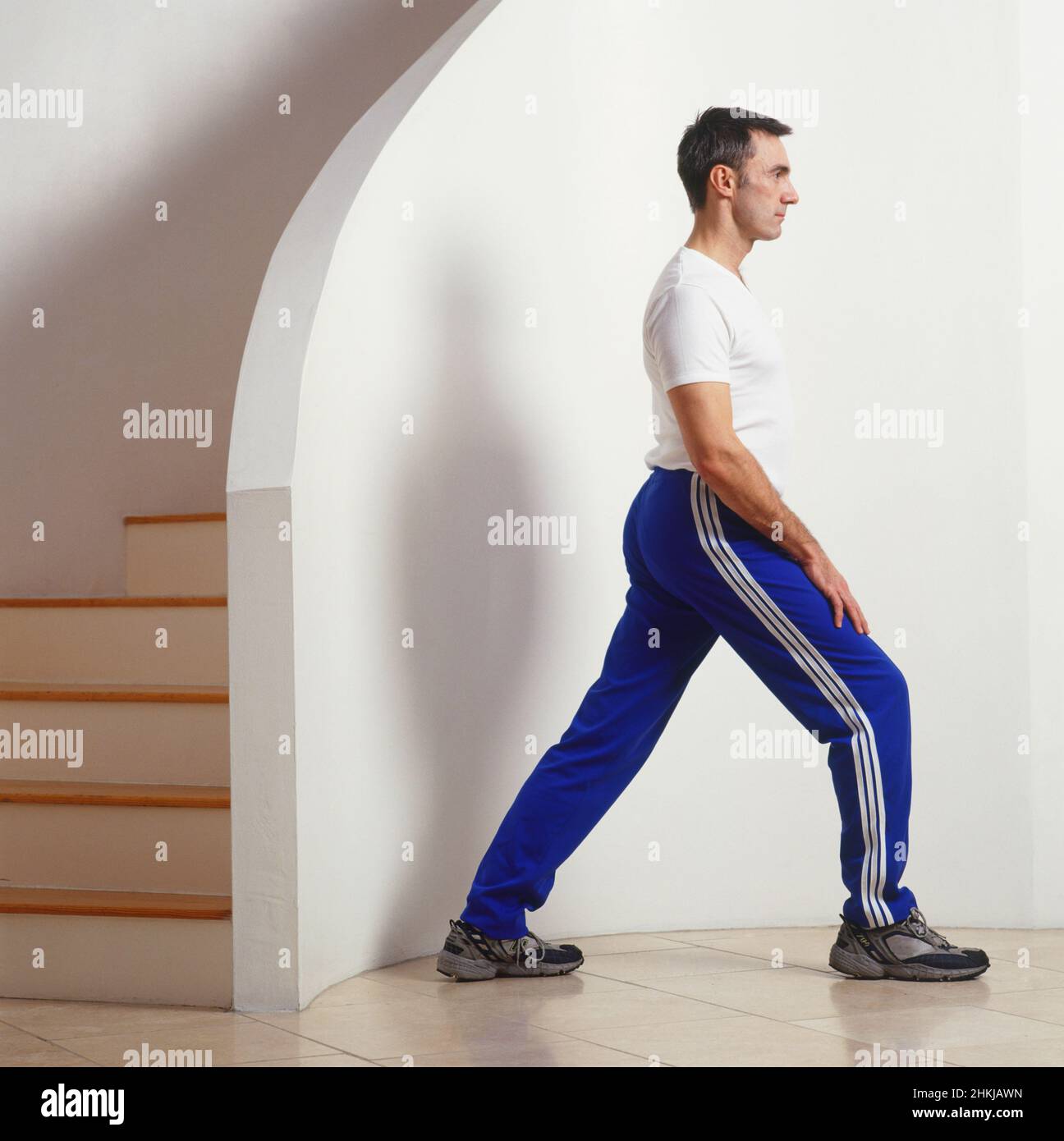 Man with back straight with feet a stride apart Stock Photo - Alamy