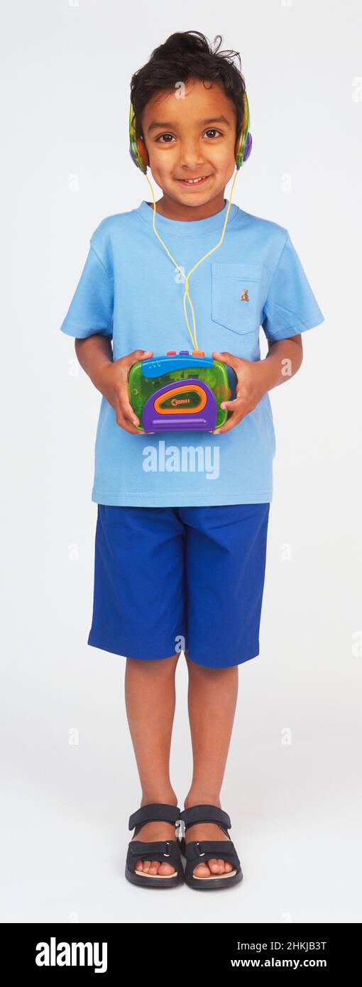 Boy holding walkman and wearing headphones Stock Photo - Alamy