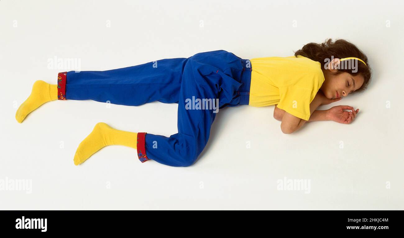 Child laying in recovery position Stock Photo - Alamy