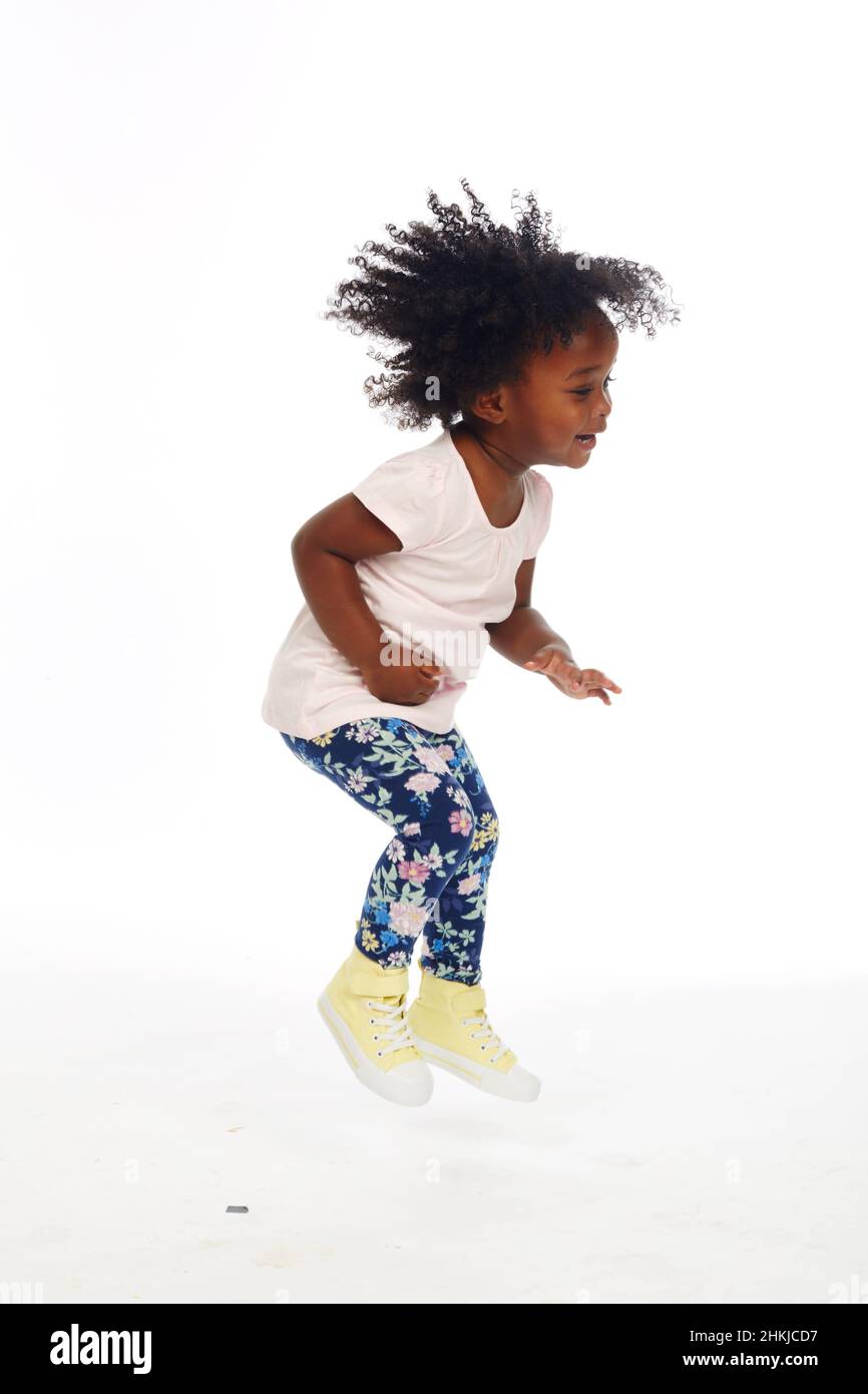 Little girl jumping Stock Photo - Alamy