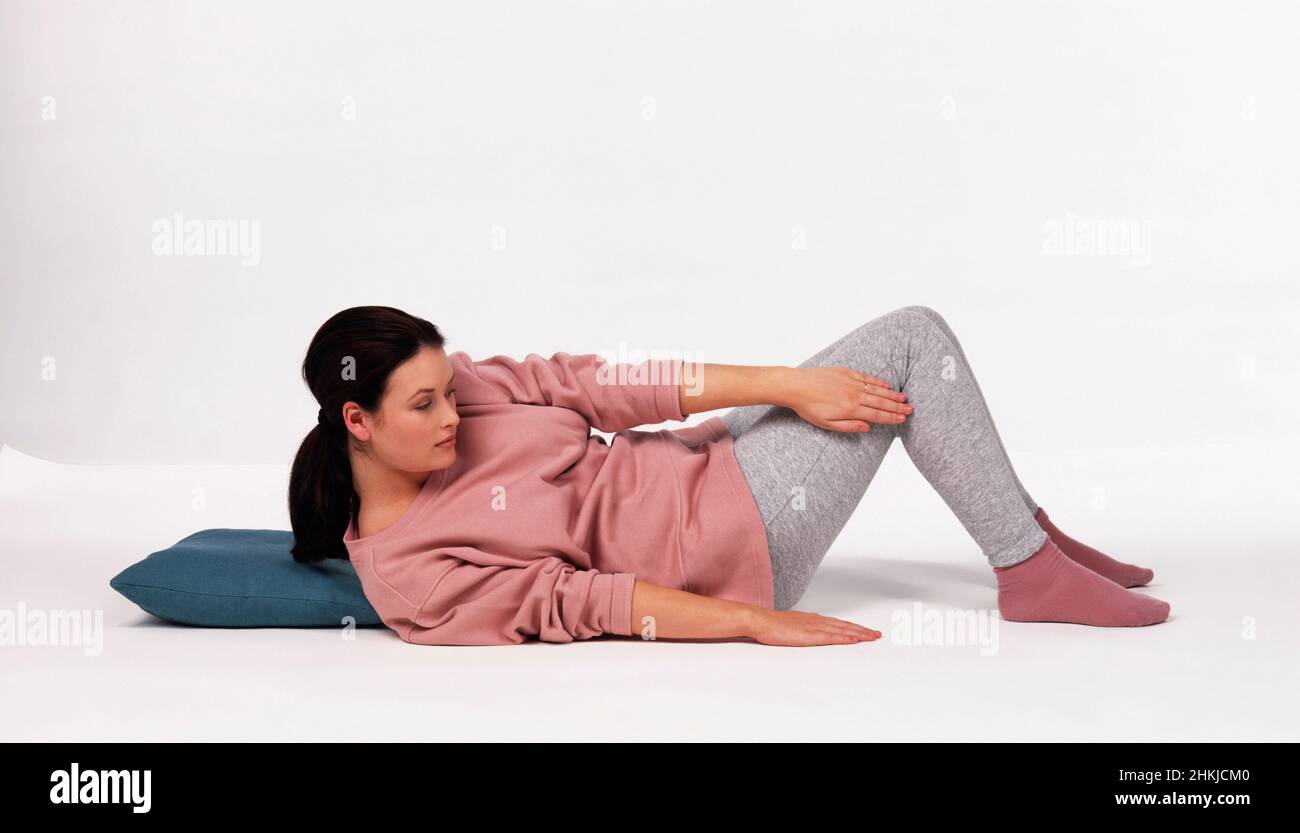 Postnatal woman exercising her stomach muscles Stock Photo - Alamy