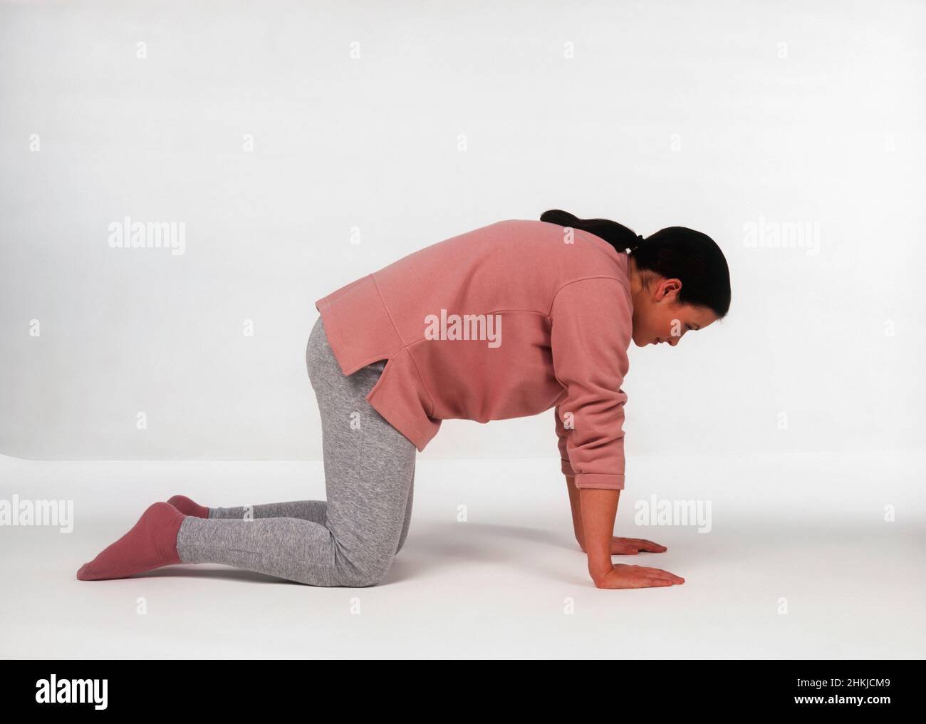 Postnatal woman preparing to exercise her back Stock Photo - Alamy