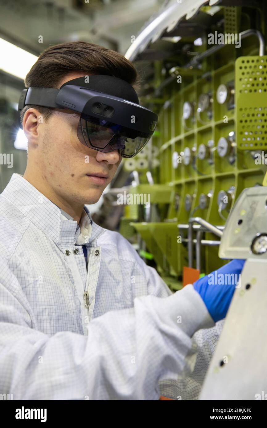 Technician using augmented reality goggles Stock Photo - Alamy