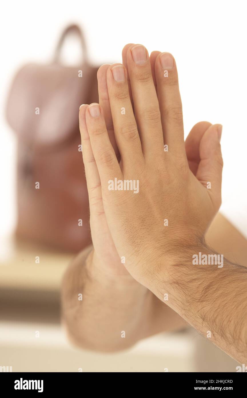 Pressing palms together and pushing fingers upward Stock Photo - Alamy