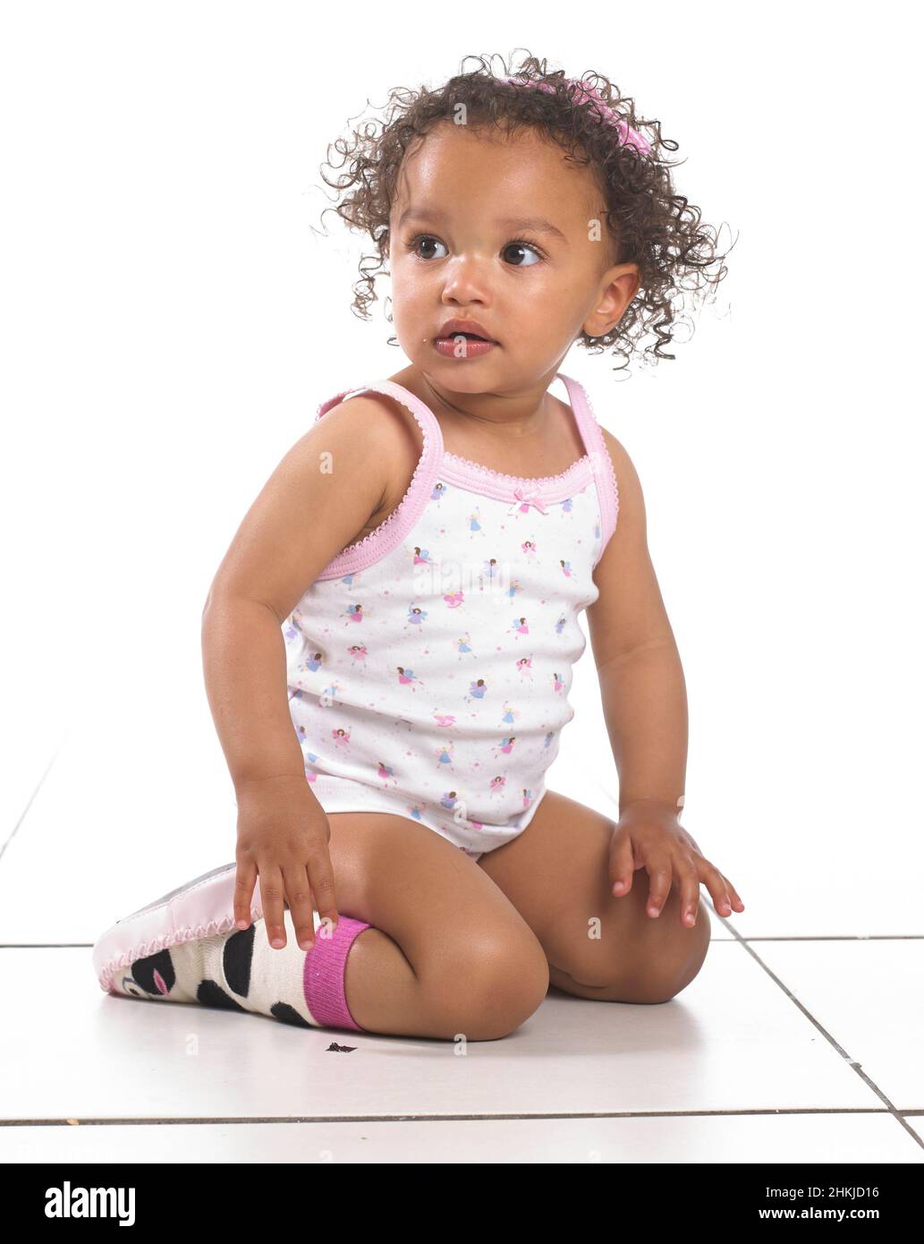 Girl wearing vest, pants and slippers Stock Photo - Alamy