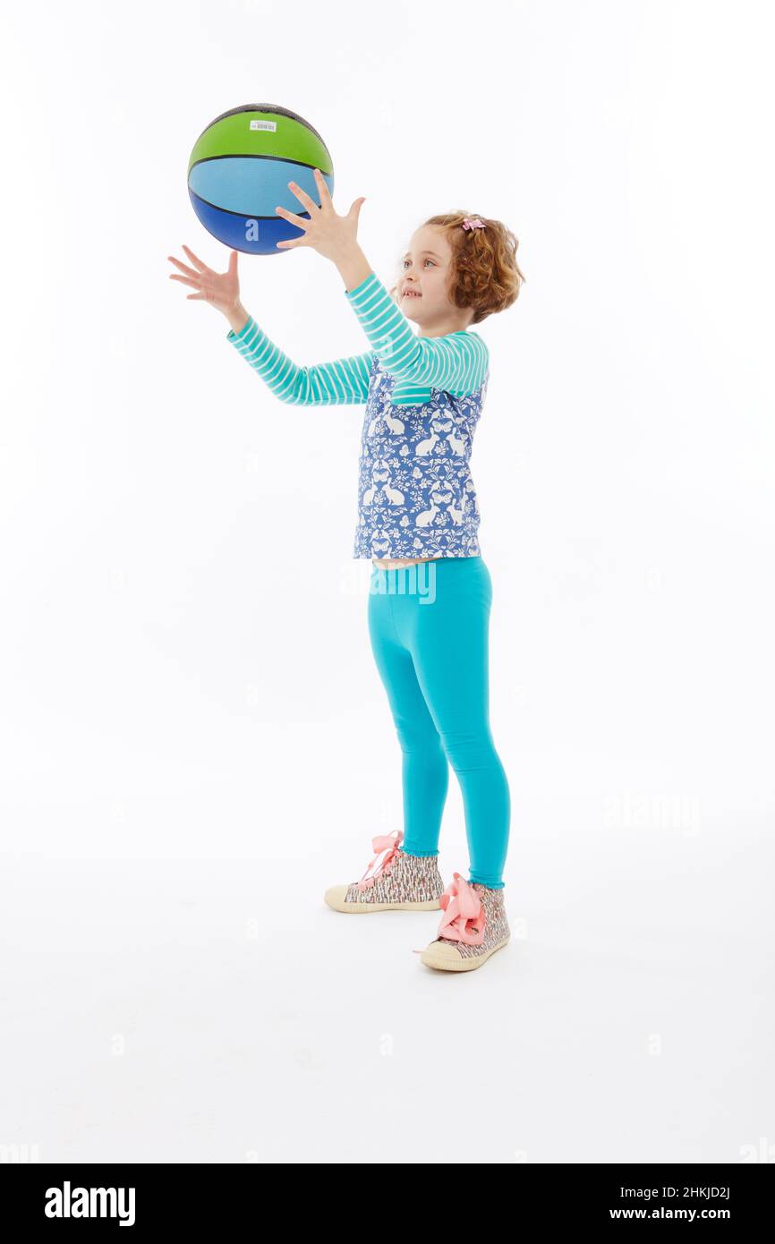 Girl playing with ball Stock Photo - Alamy
