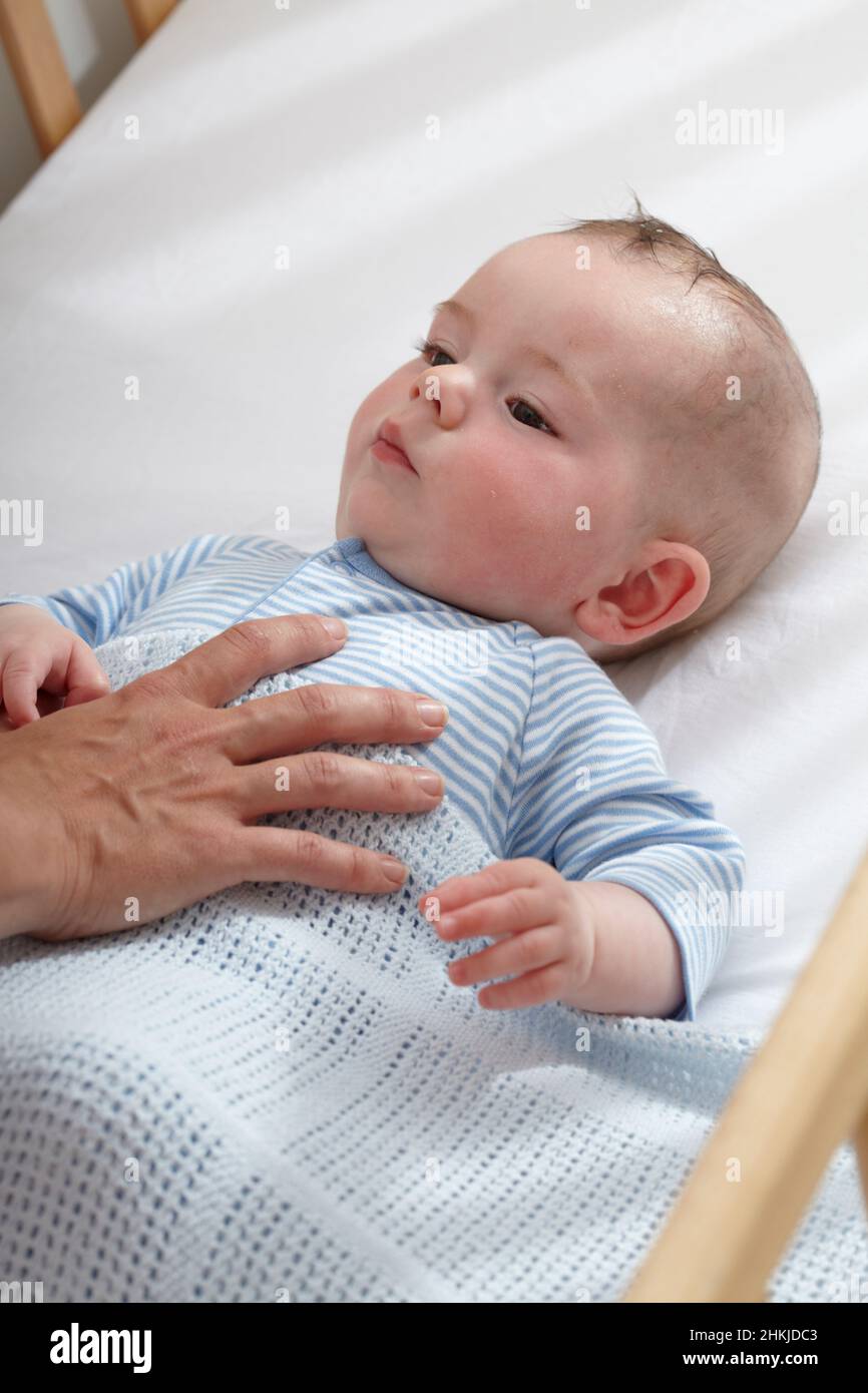 Hand on chest of baby boy Stock Photo - Alamy