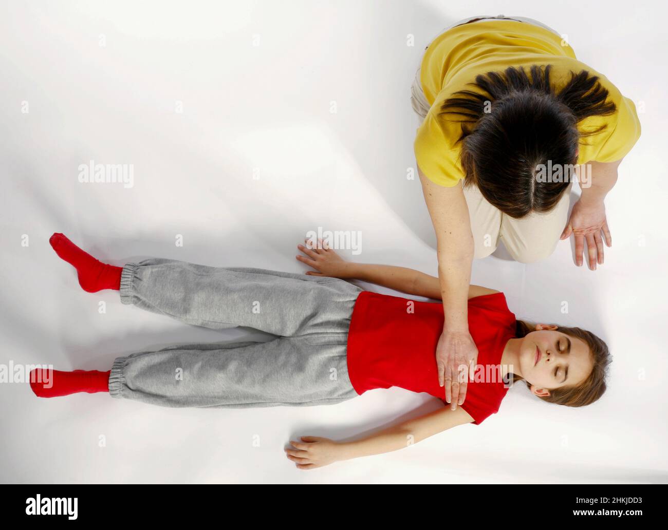 Administering chest compression Stock Photo - Alamy