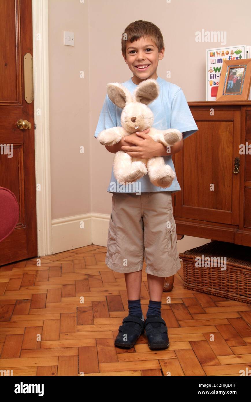 Boy holding soft toy Stock Photo - Alamy