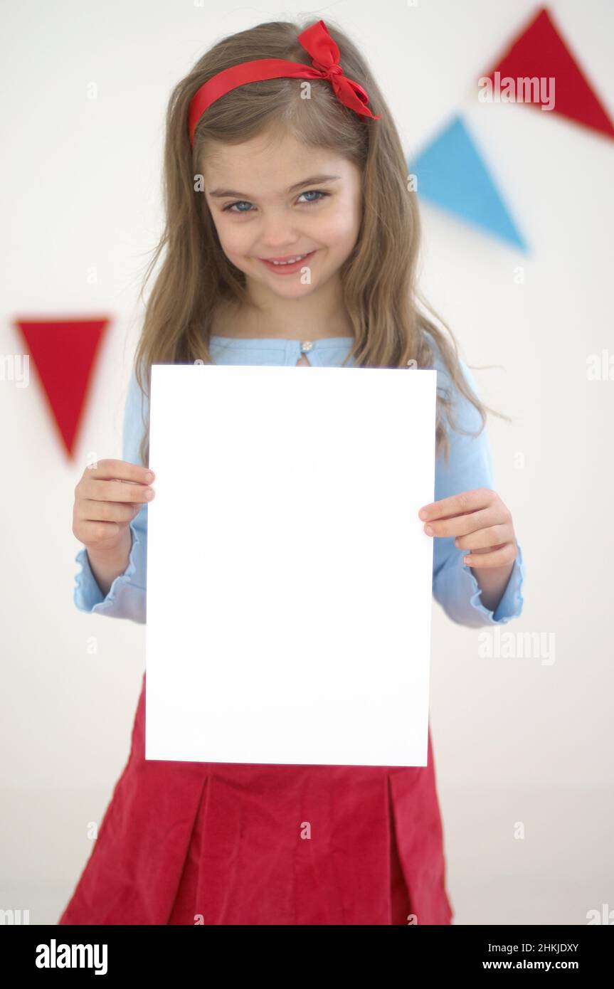 Girl holding piece of blank white paper Stock Photo - Alamy