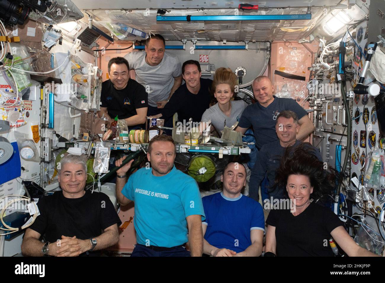 Group portrait of astronauts and space tourists on the ISS Stock Photo ...