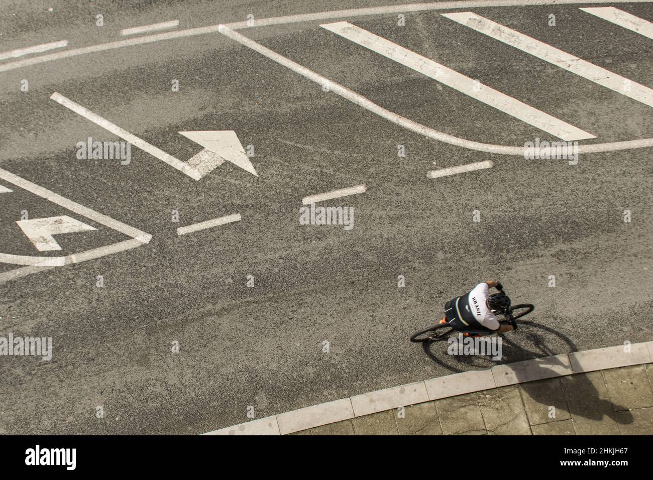 Cyclist rides on a track with signs on the ground Stock Photo - Alamy