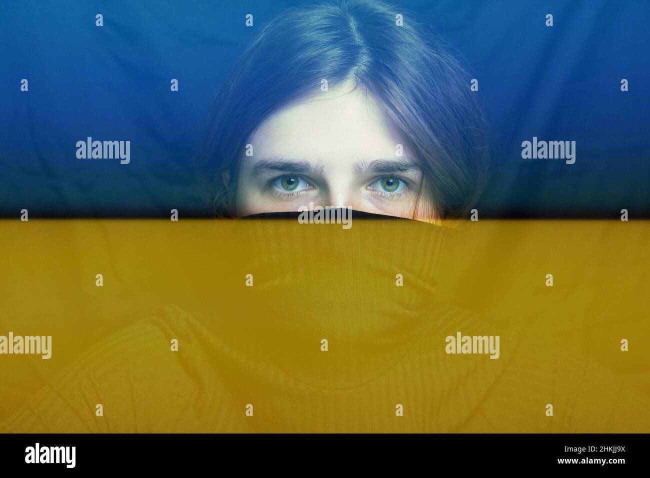 War between Russia and Ukraine. Young woman with sad sight looking at ...