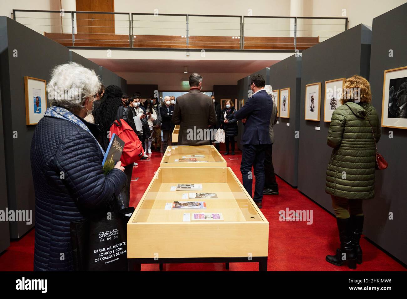 Visitors to the Caricature exhibition look at the artworks during the ...