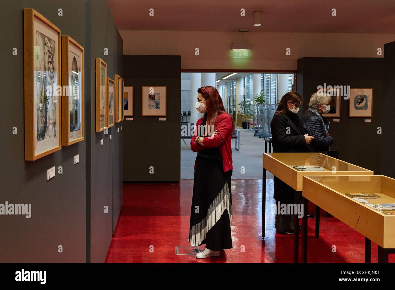 Visitor to the Caricature exhibition looks at the artworks during the ...