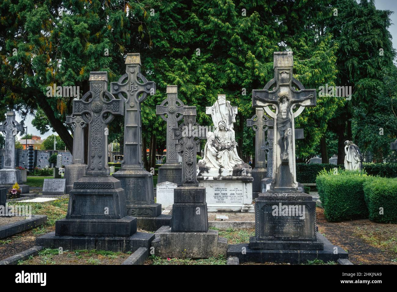 Dublin, Ireland, August 2019 Ancient graves with Celtic crosses and ...