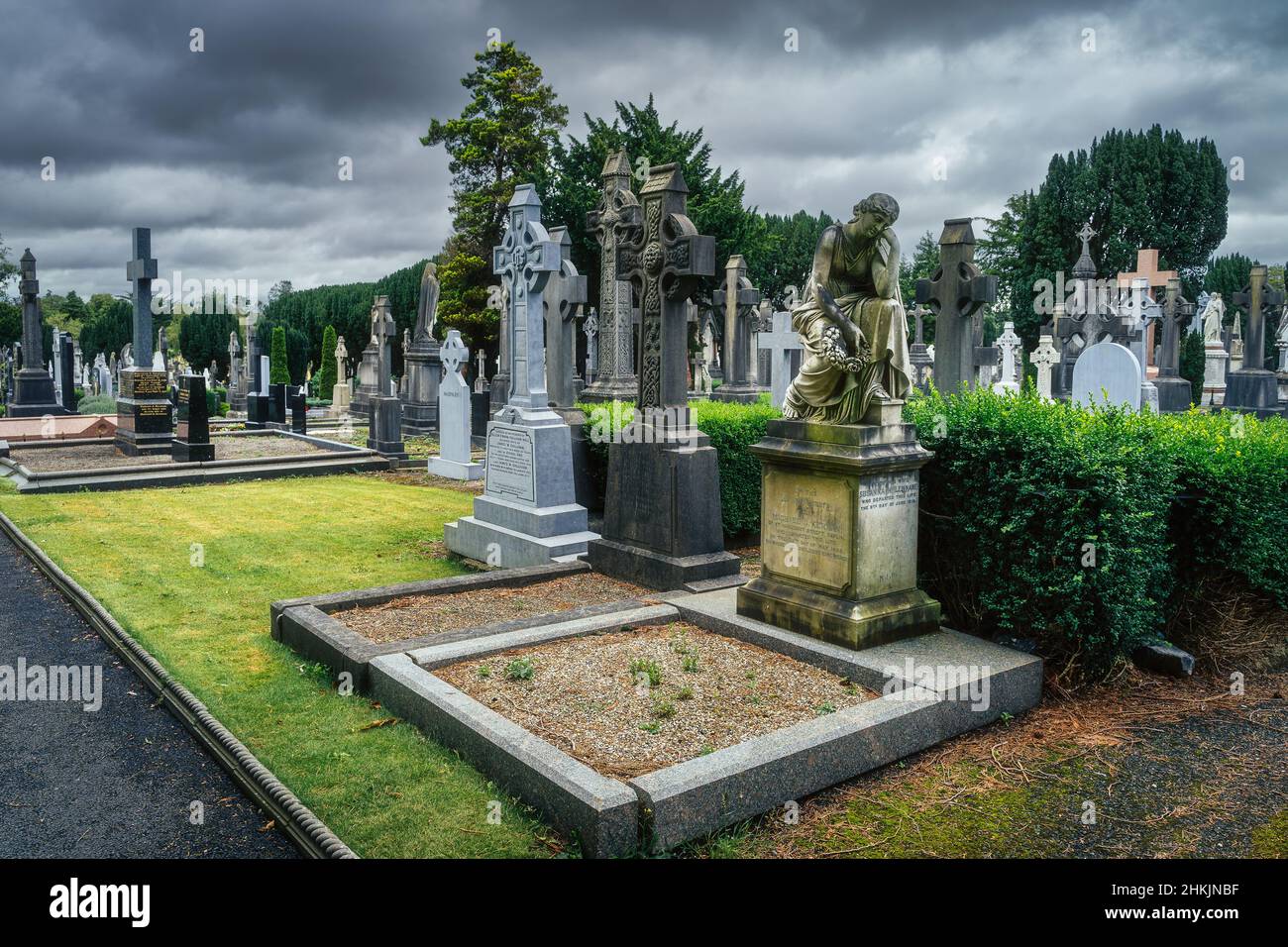Dublin, Ireland, August 2019 Ancient graves with Celtic crosses and ...