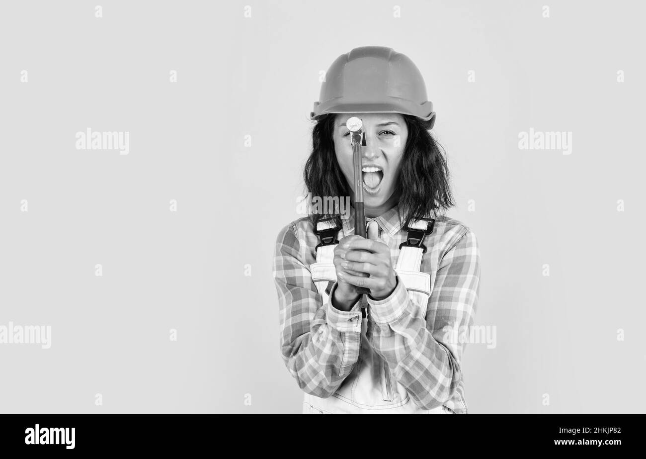 Tools for repair. girl carpenter use hammer. happy beautiful lady ...