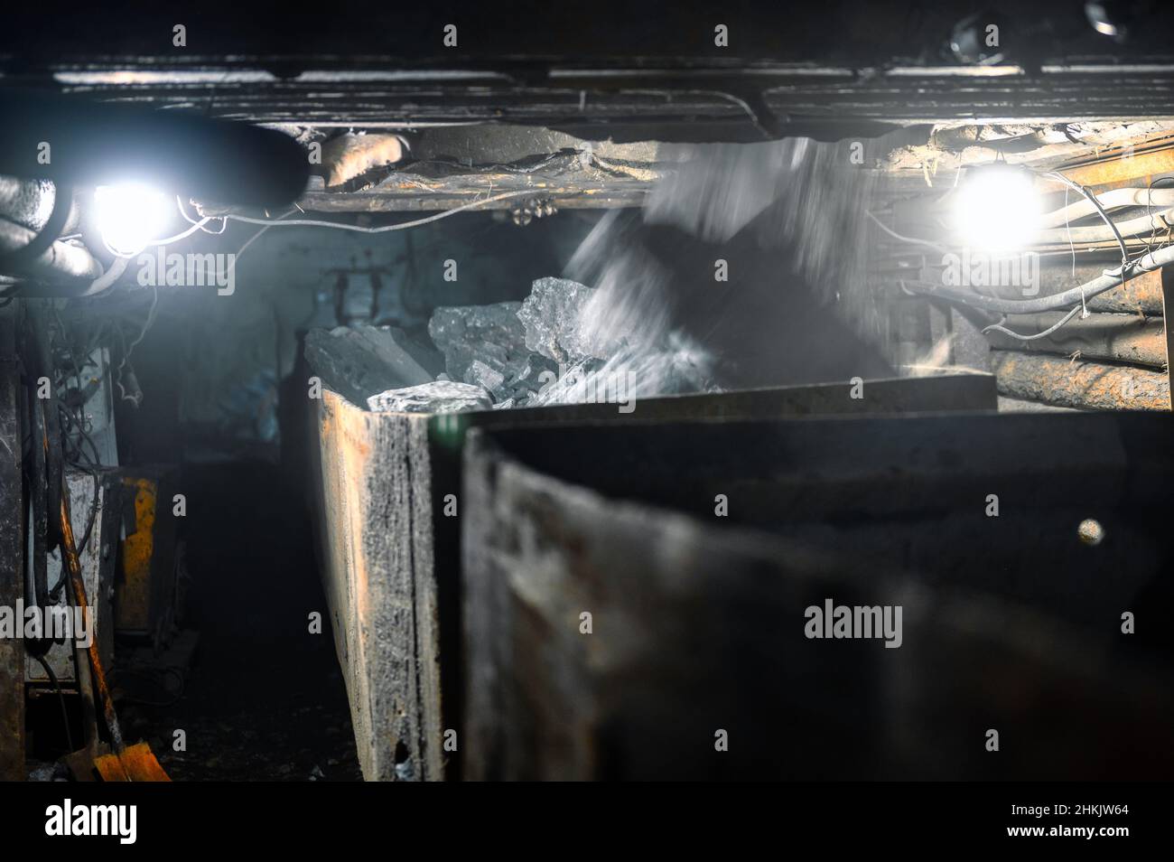 Loading a mine car with ore and stones Stock Photo - Alamy