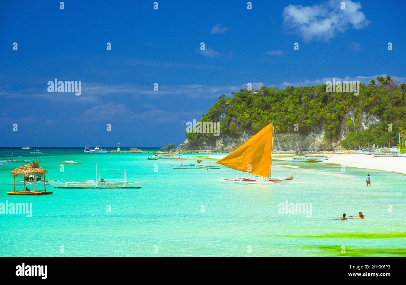 The famous sandy shore, vibrant white sands and shallow pastel waters ...