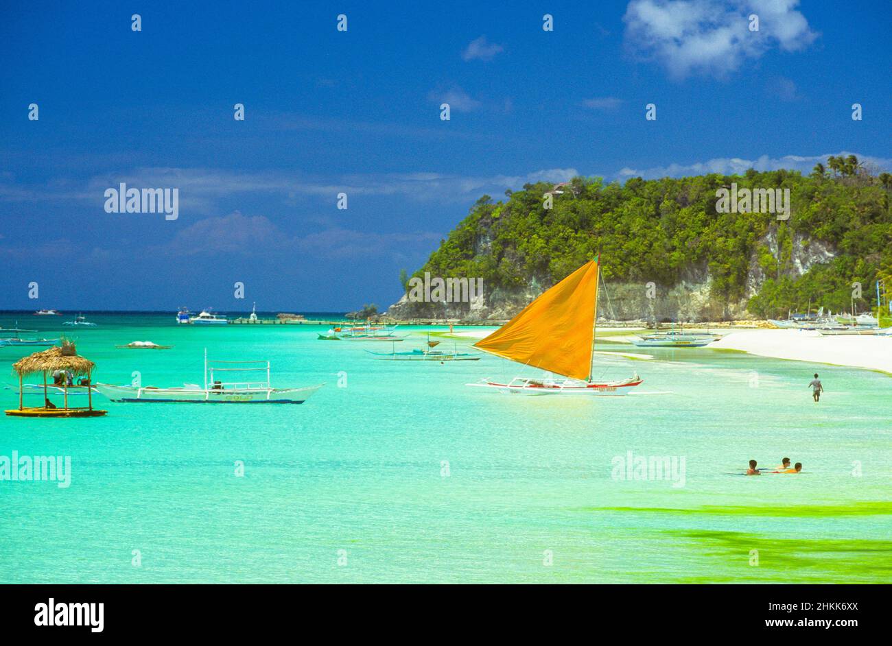 The famous sandy shore, vibrant white sands and shallow pastel waters ...