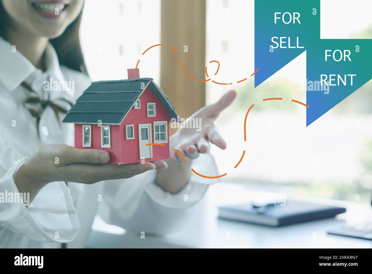 A woman holding and checking house model .Real Estate House Appraisal ...
