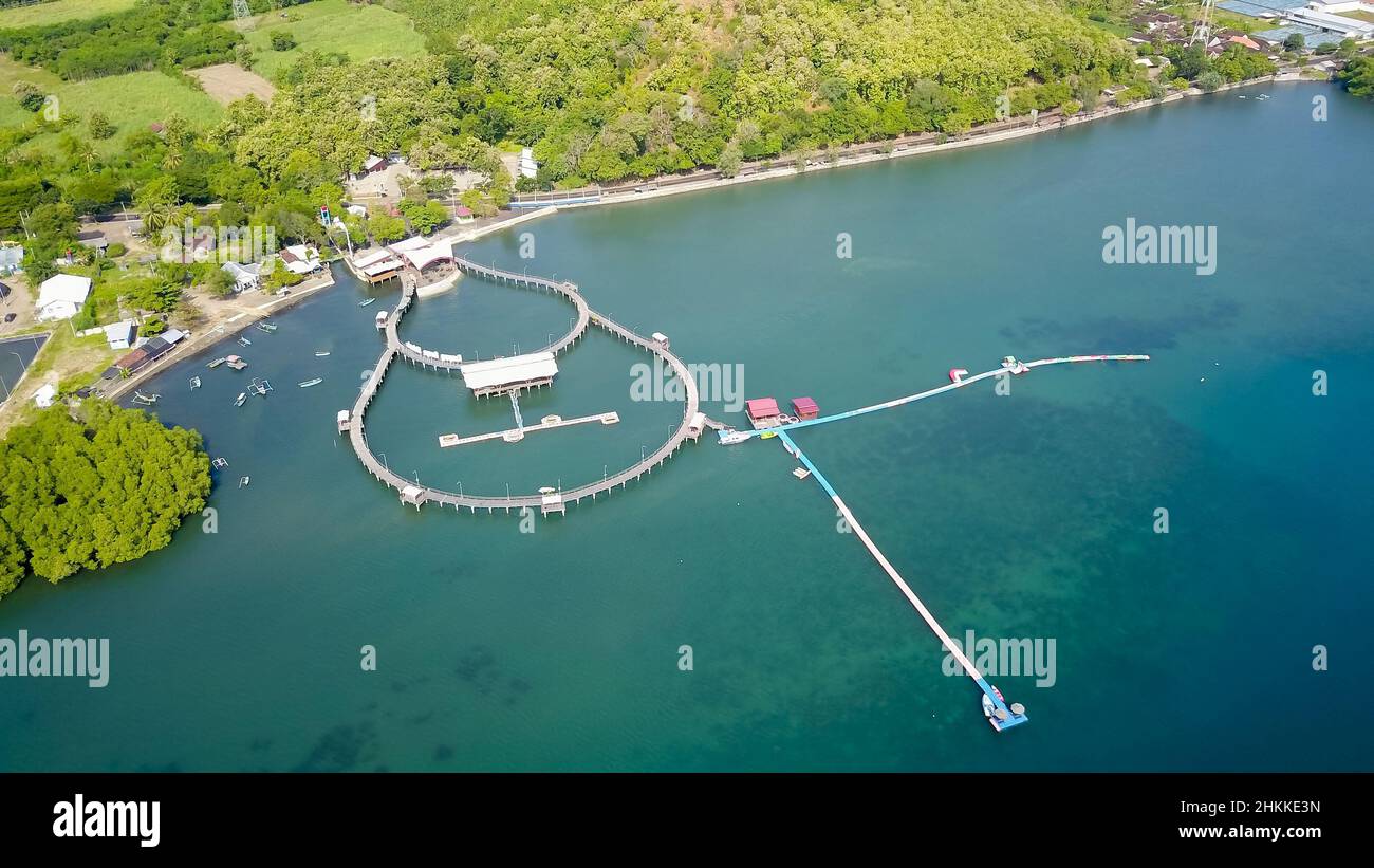 Aerial view of pedestrian bridge over sea. Narrow wooden bridge with ...