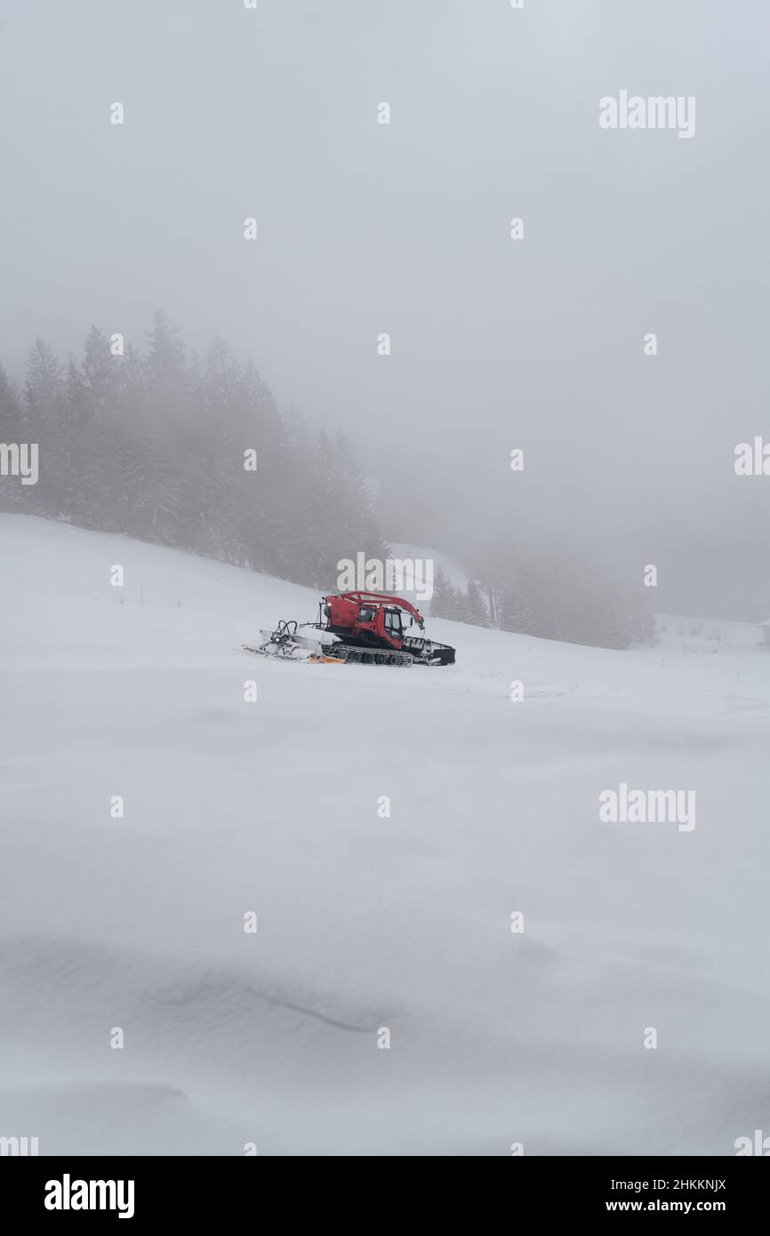 Vertical shot of a Snowcat in a mountainside Stock Photo - Alamy